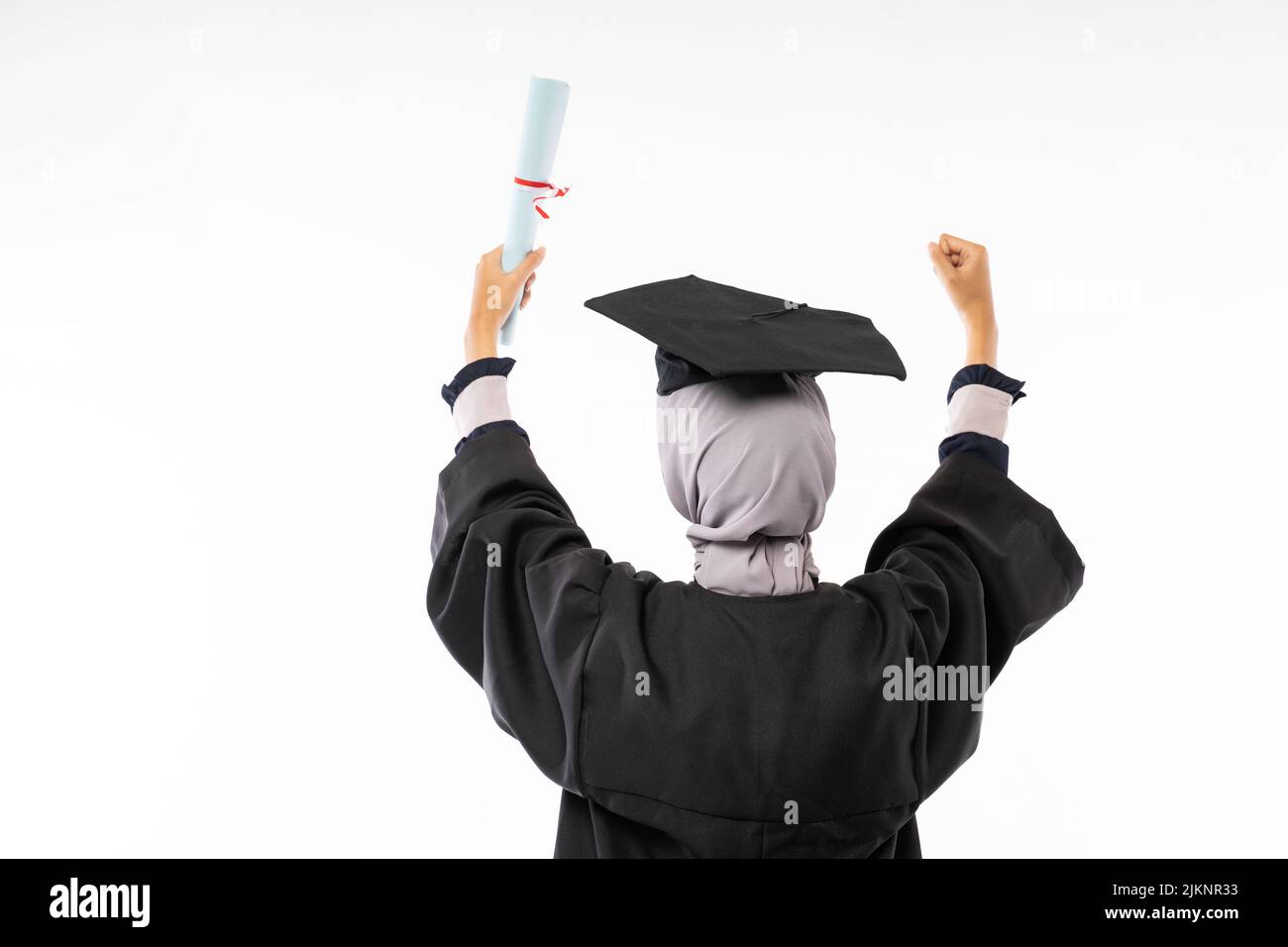Rear behind view photo of female college graduate wearing toga Stock ...