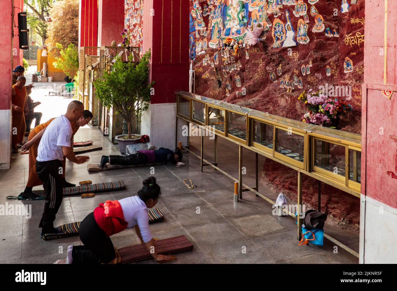 Lhasa, Tibet - August 3, 2022: Tibetan people performing prostrations ...