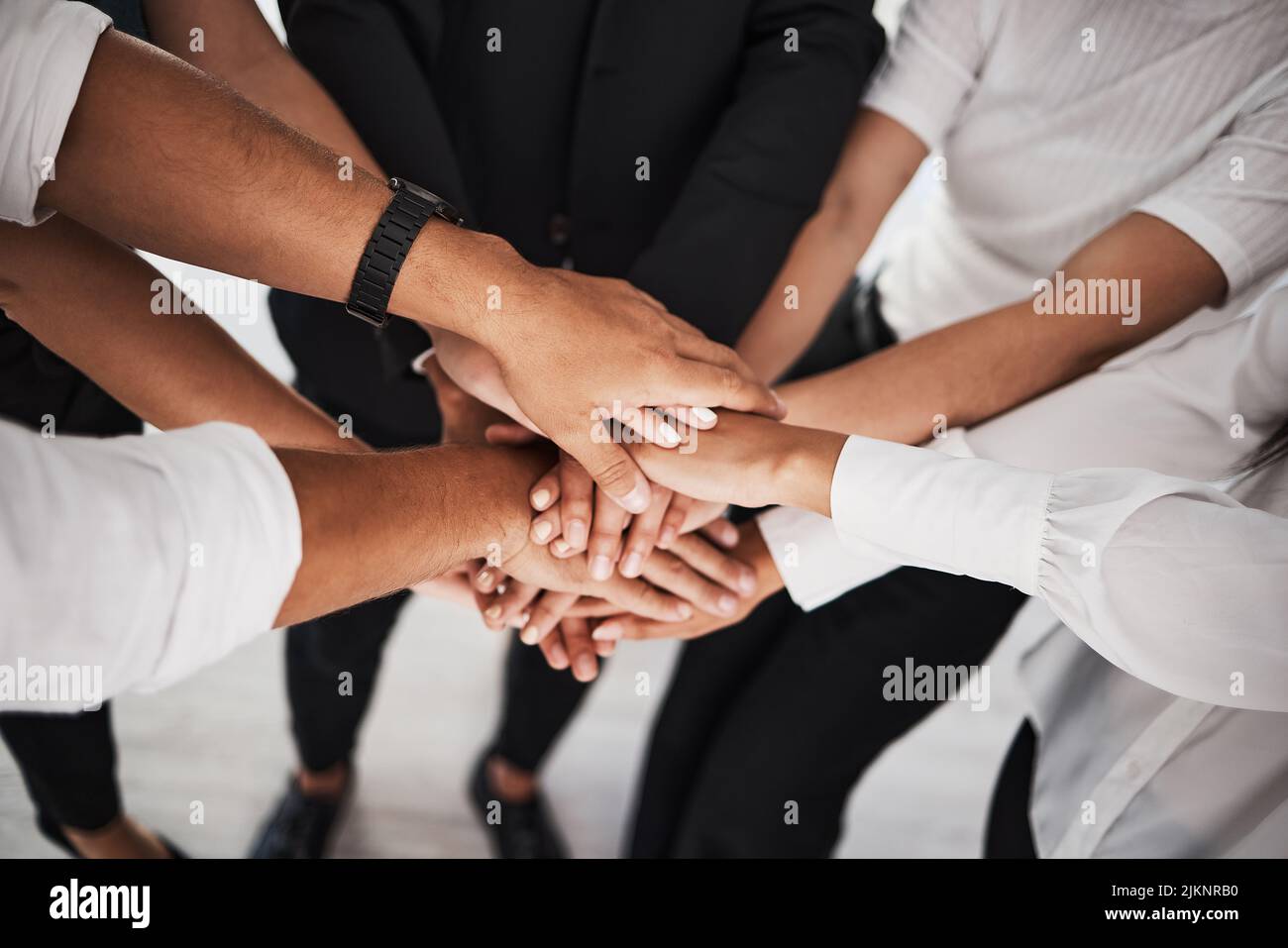 Teamwork leads to many victories. Closeup shot of a group of unrecognisable businesspeople ...