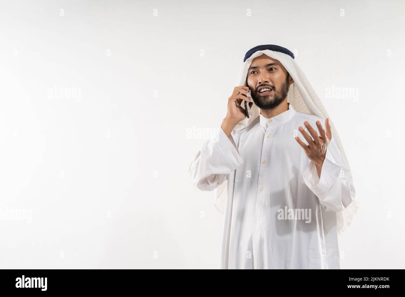 man in a turban is calling using a mobile phone while smiling Stock ...