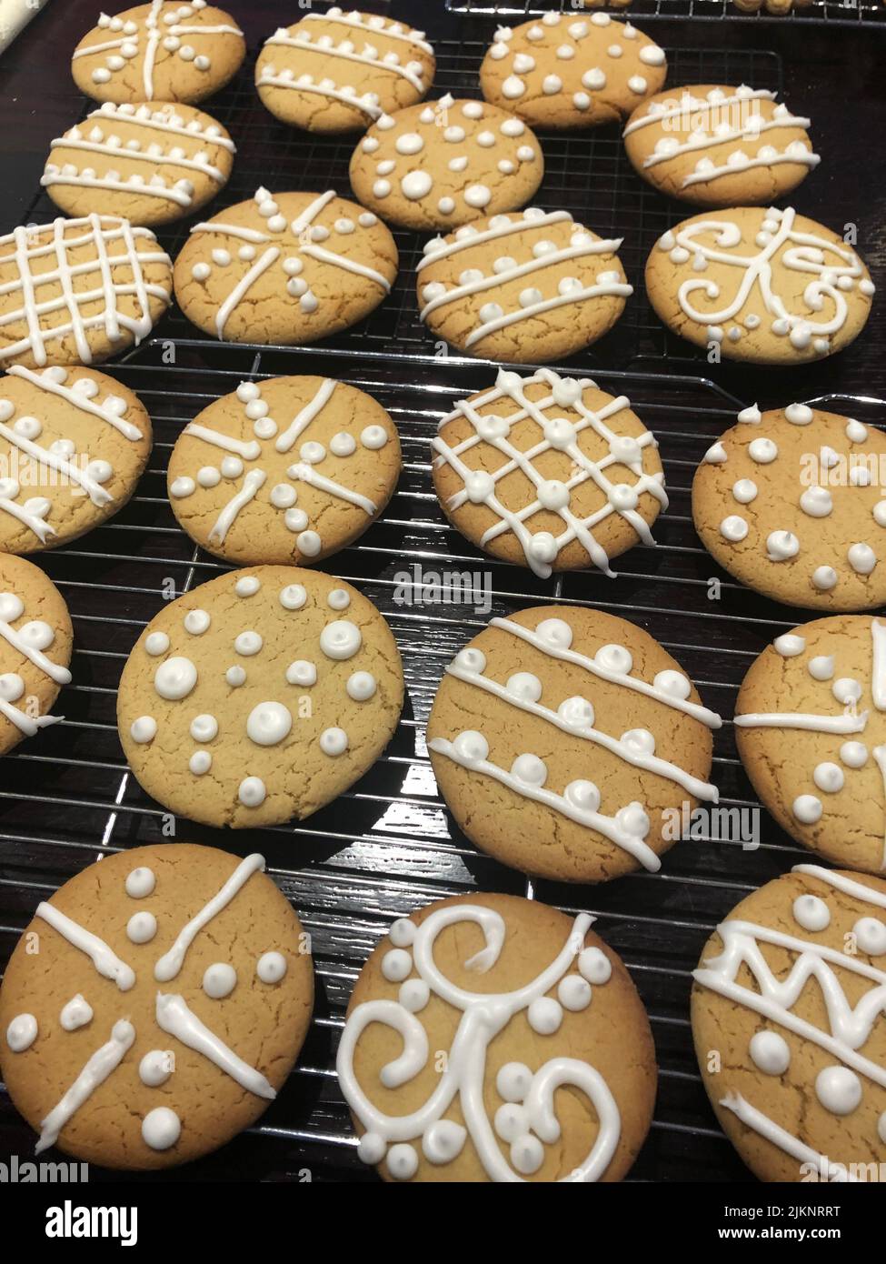 freshly decorated gingerbread cookies with white royal icing different ...