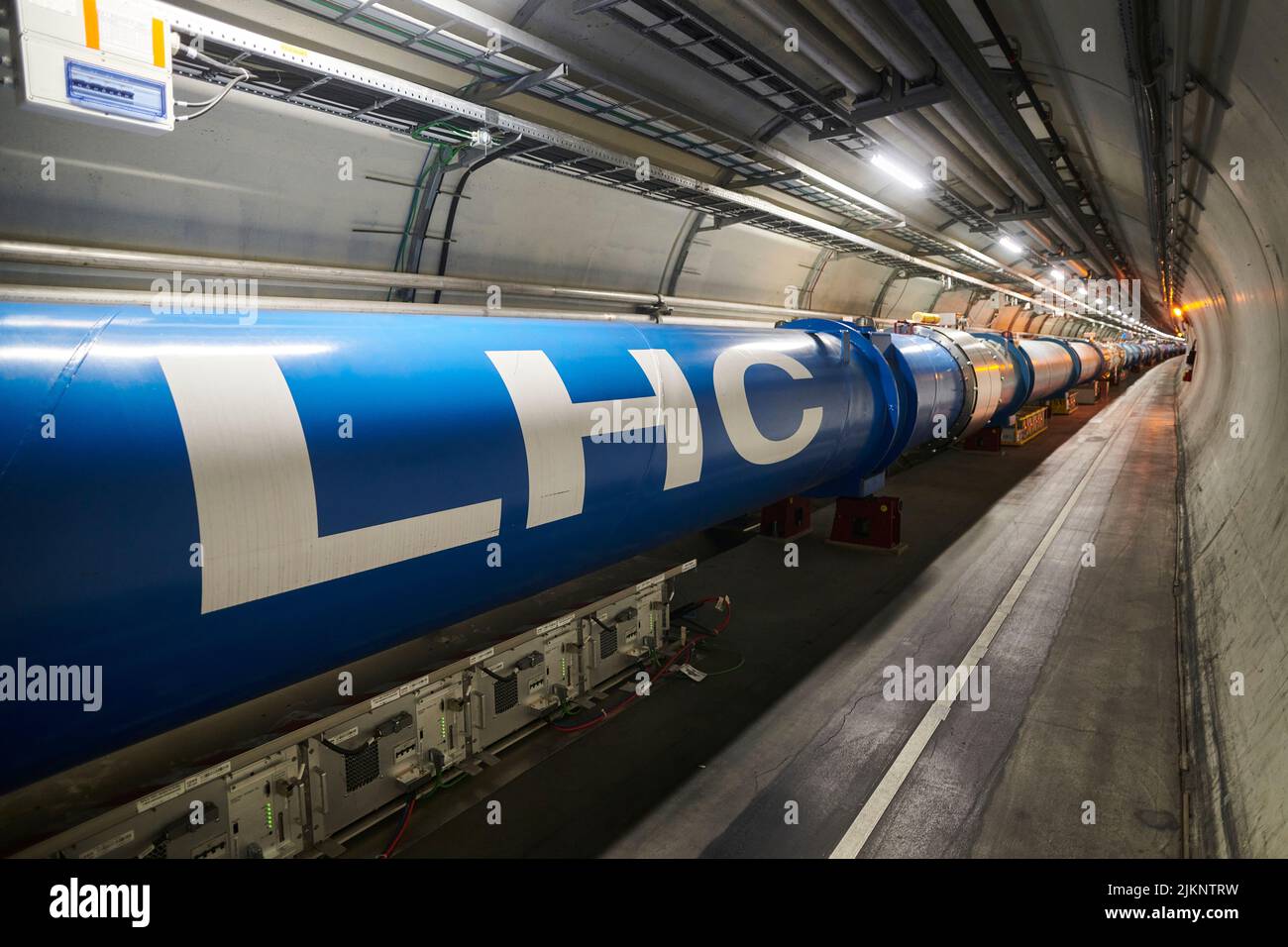 Chain of Large Hadron Collider dipole magnets inside tunnel Stock Photo ...