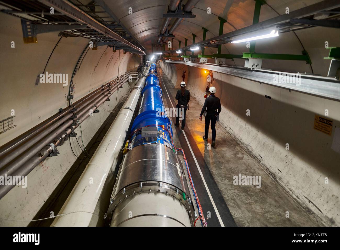 Chain of Large Hadron Collider dipole magnets inside tunnel Stock Photo ...