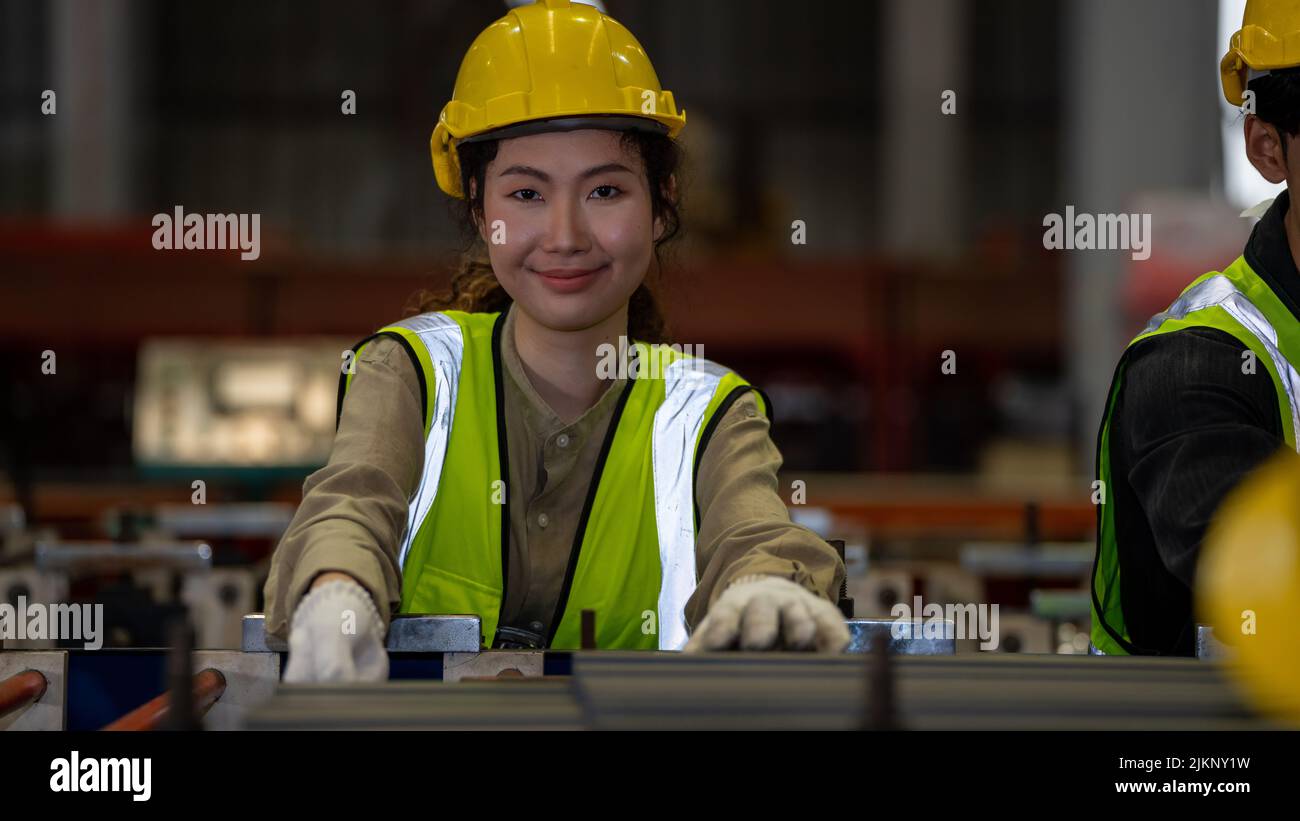 Smile woman Heavy Industry worker in Manufacturing Factory Stock Photo ...