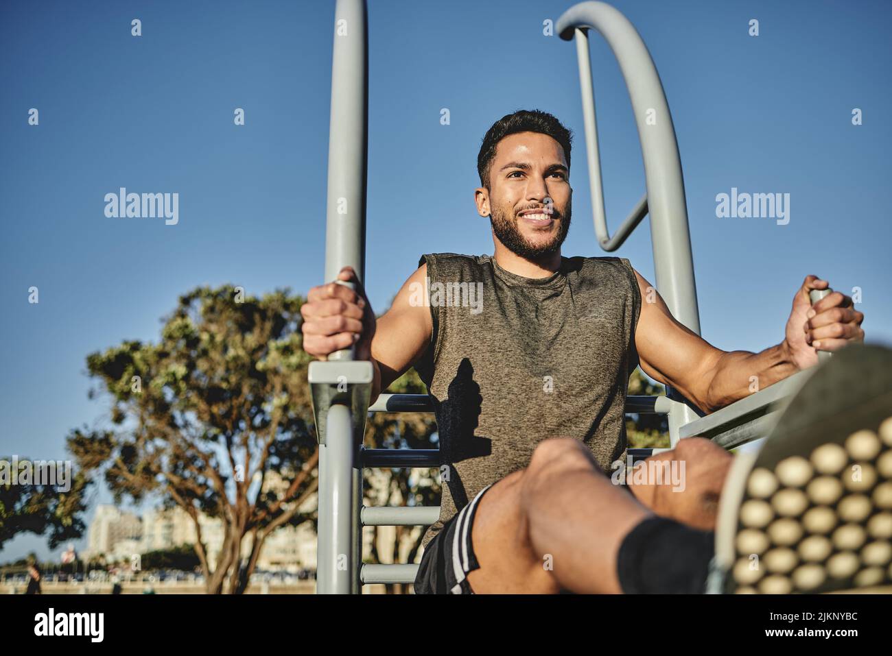 Get fit and stay awesome. a muscular young man exercising at a ...