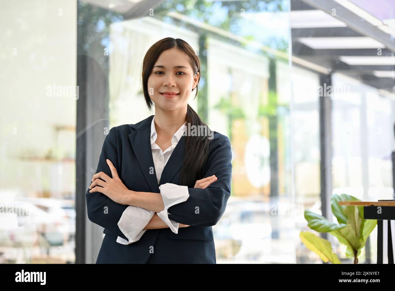 Successful and professional young Asian businesswoman or female ...