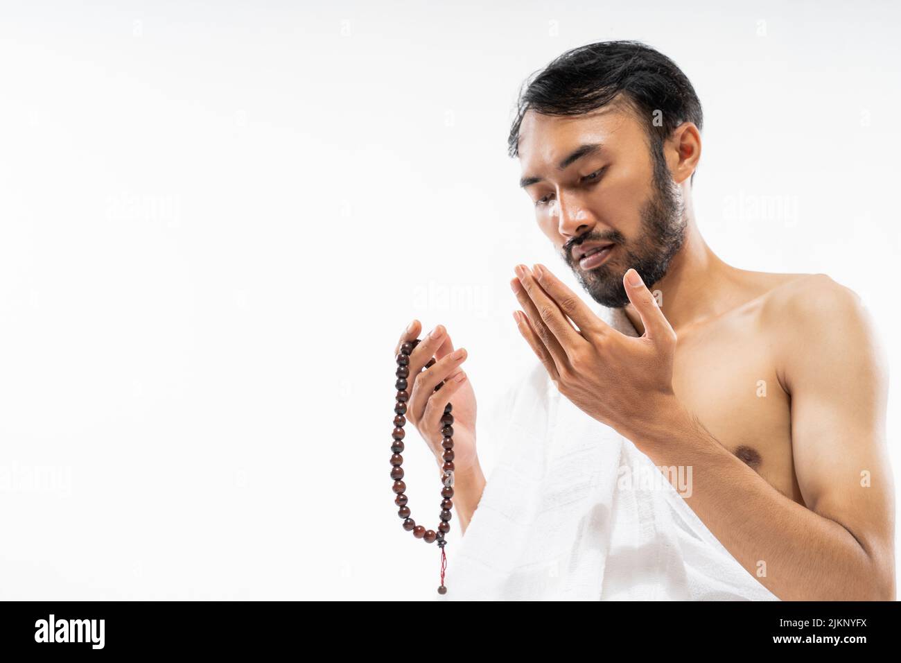 Close up of asian man praying with prayer beads Stock Photo - Alamy