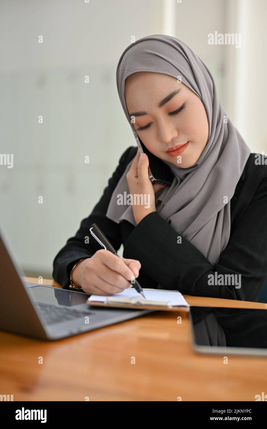 Portrait, Attractive and professional young Asian Muslim businesswoman ...