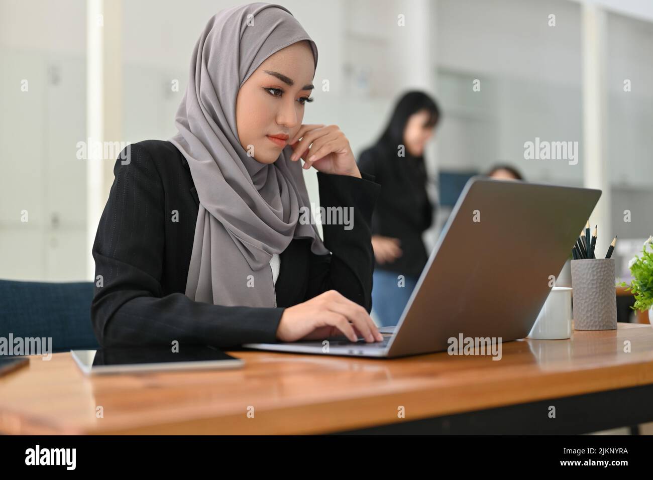 Professional millennial Asian Muslim businesswoman or female manager ...