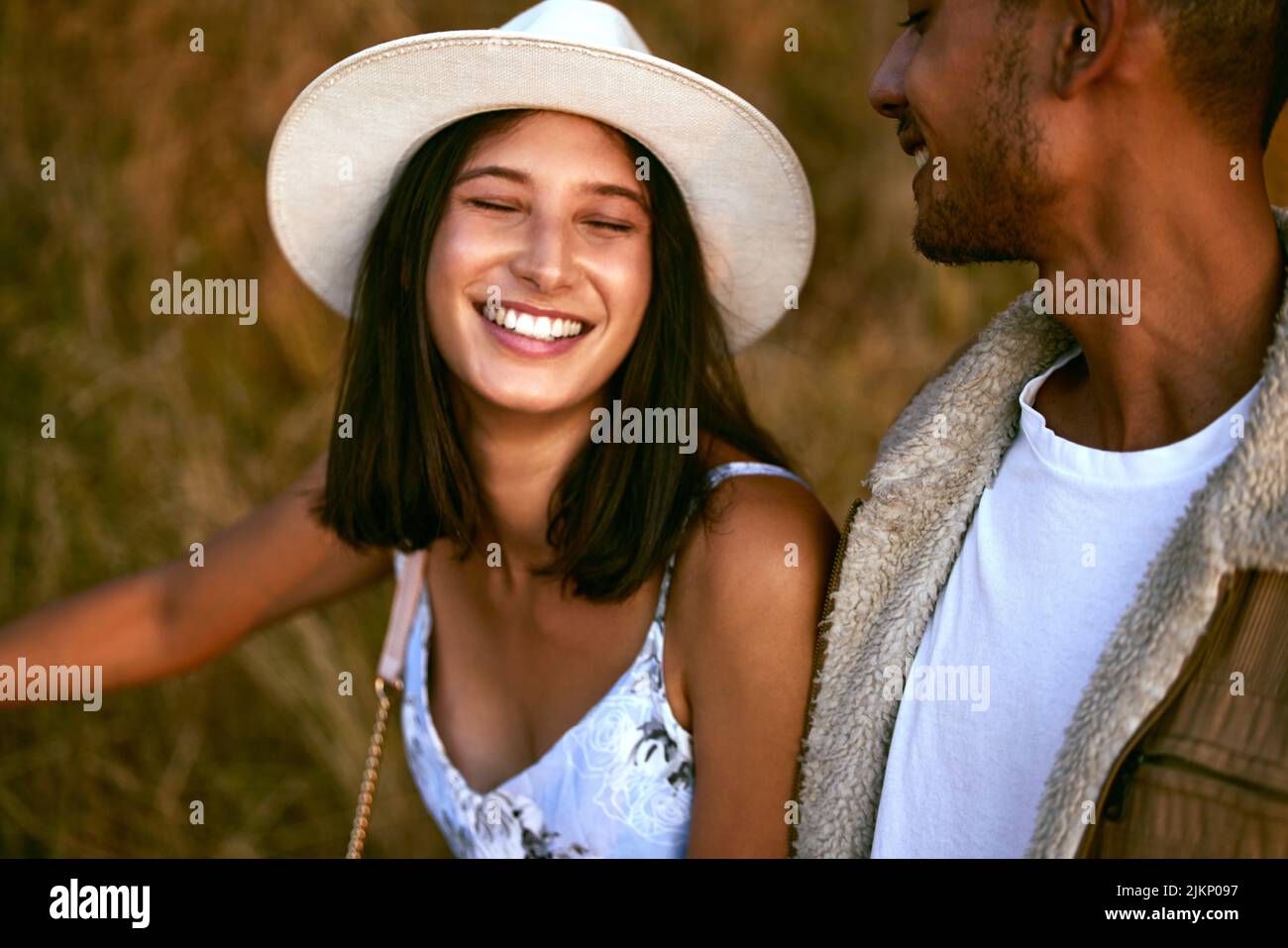 Made for one another. a young couple enjoying the sunset walk with ...