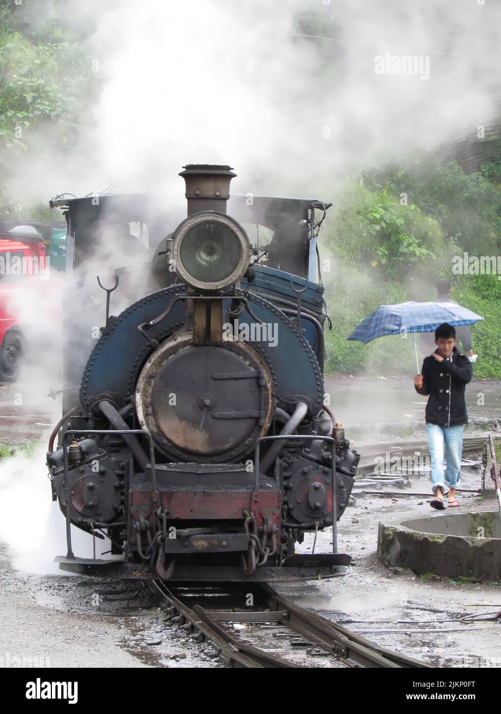 A morning at the Ghum train station in Darjeeling, India with a train ...