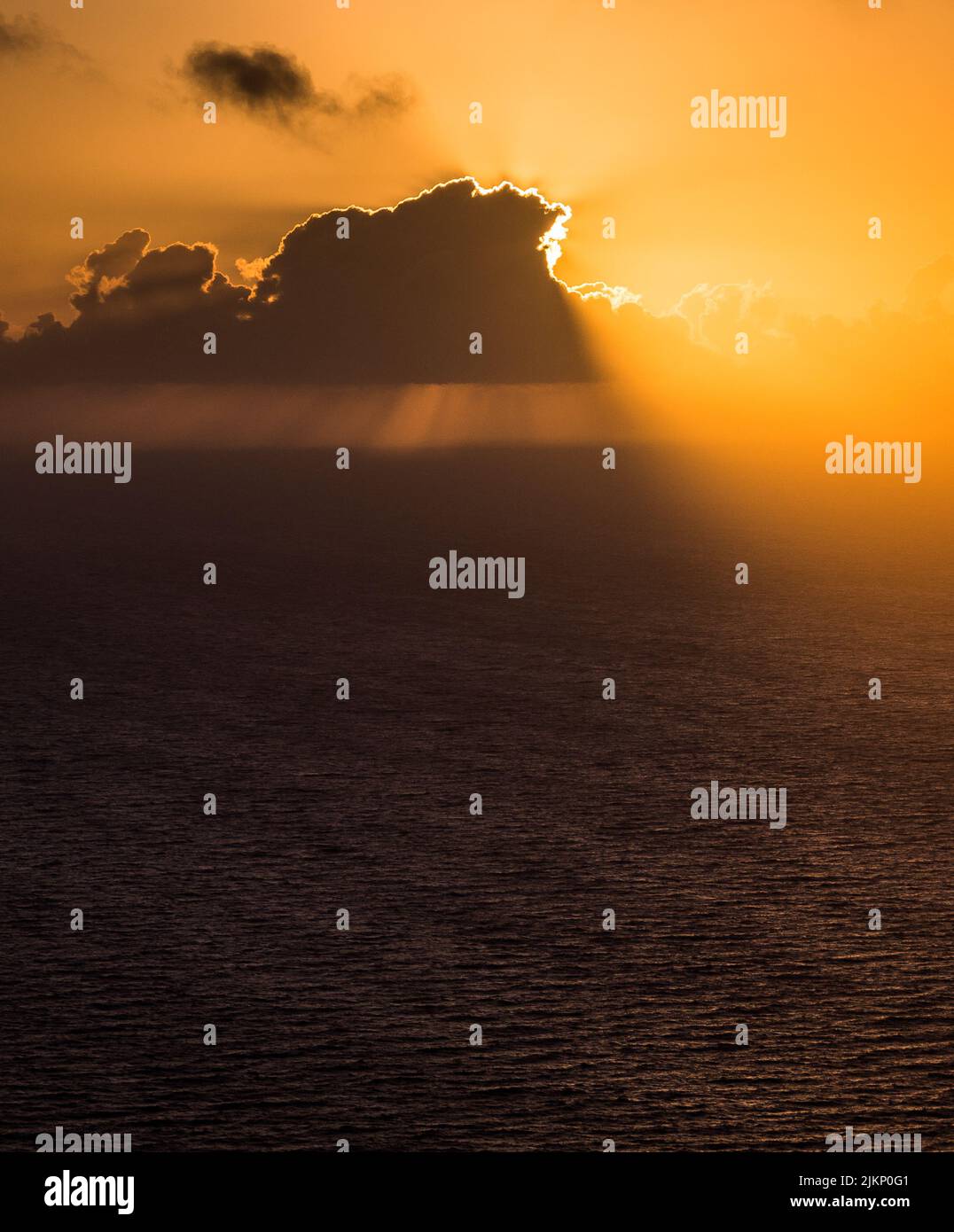 A mesmerizing sunset view over the sea captured at a dark evening Stock ...