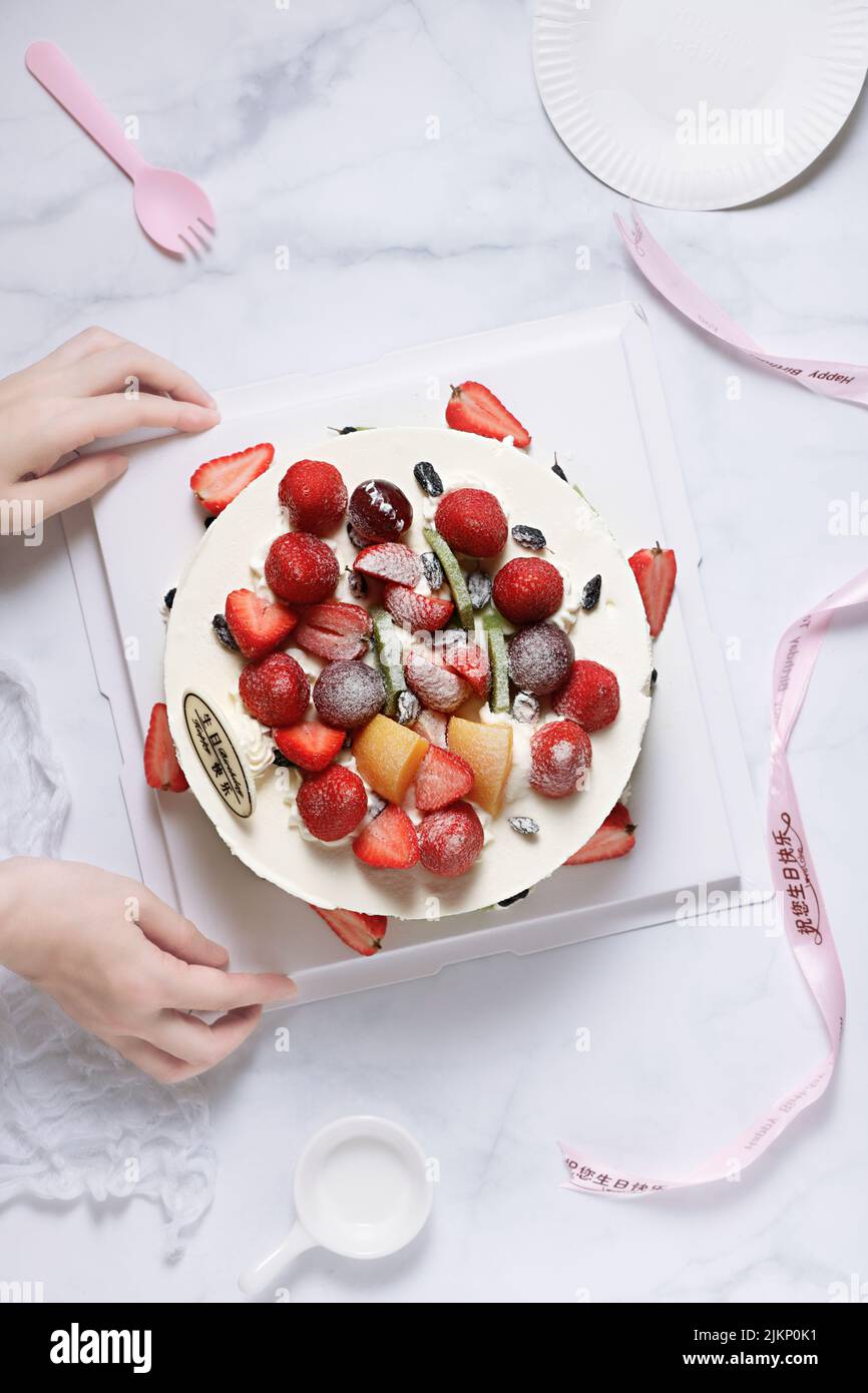 A vertical shot of a birthday cake on the white background Stock Photo ...