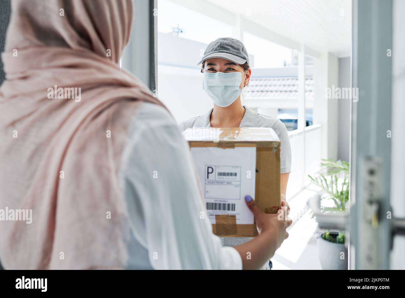 Talk about express shipping. an attractive young woman standing and ...