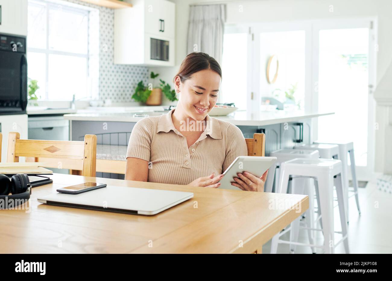 Ive almost completed my to-do list. an attractive young woman sitting ...