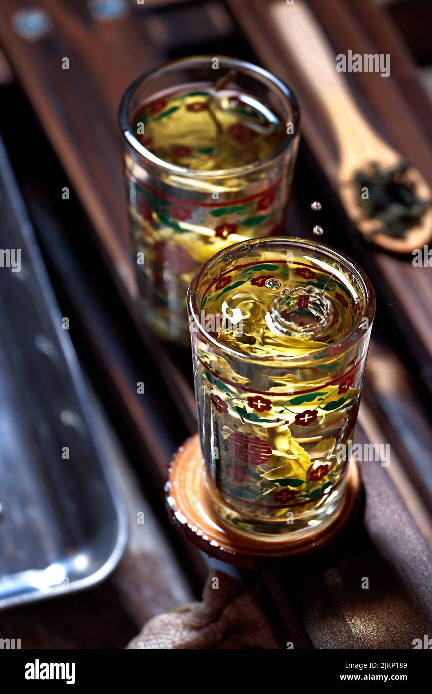 a vertical shot of alcohol drink in glass cup Stock Photo - Alamy