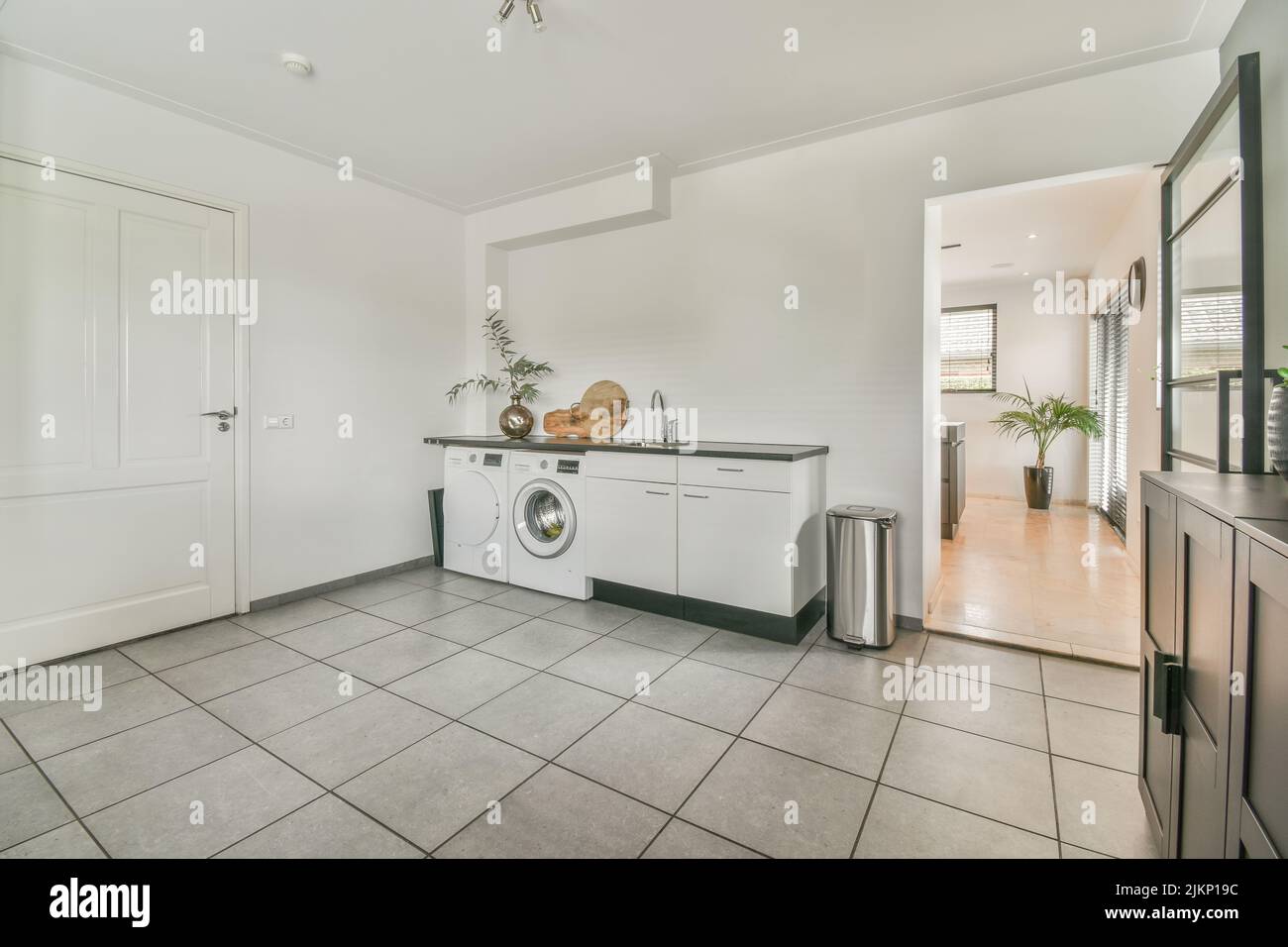 Comfortable bed placed near green wall in modern minimalist style ...