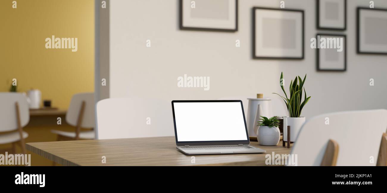 Laptop computer white screen mockup, decor plants and stuff on wood ...