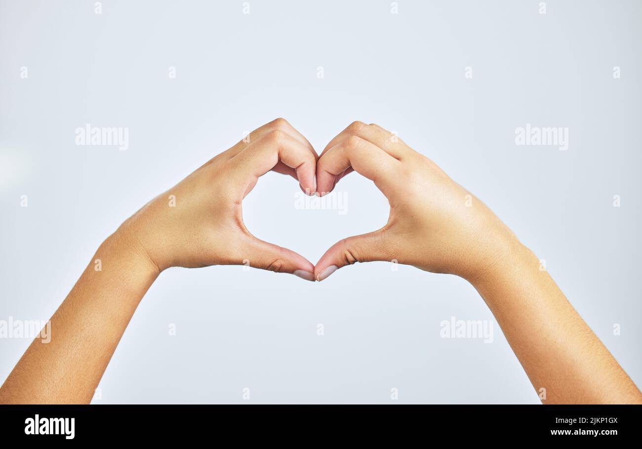 All you need is love. an unrecognizable woman forming a heart shape ...