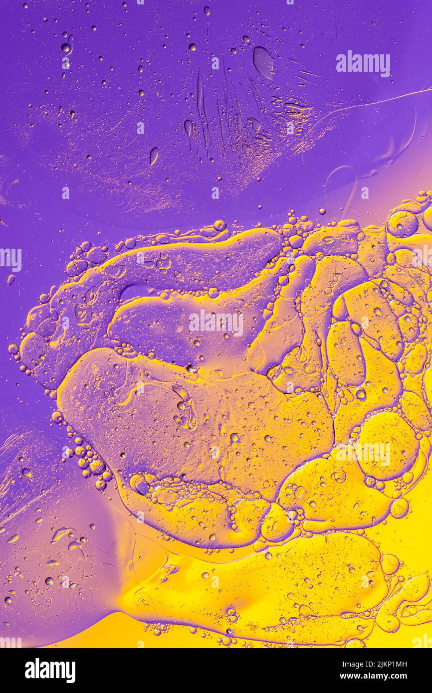 A vertical oil mixed with water abstract background Stock Photo - Alamy
