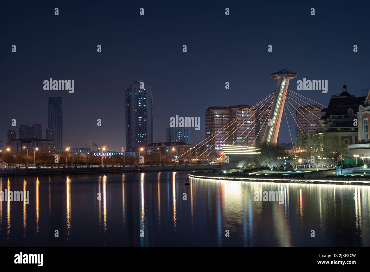 The famous bridge in Tianjin city at night along the Haihe River, China ...