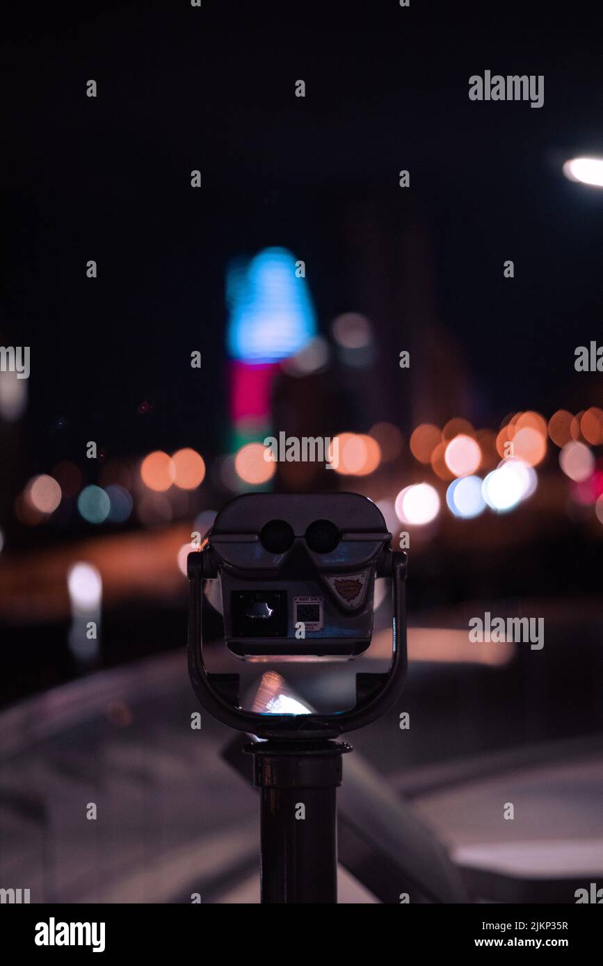 Shallow focus on a tower viewer With bokeh lights at night in Baku ...