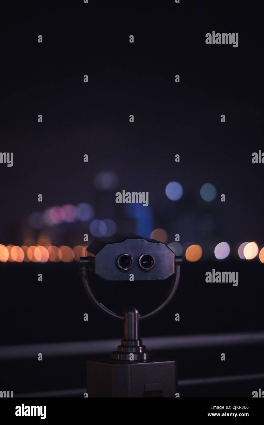 Shallow focus on a tower viewer With bokeh lights at night in Baku ...