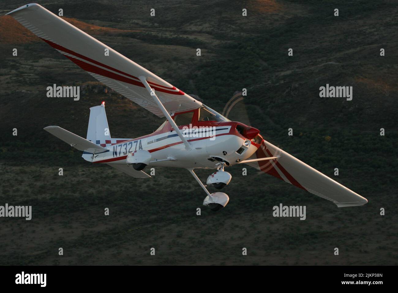 The Cessna 150 Aerobat A150M flying formation desert mountains Stock ...