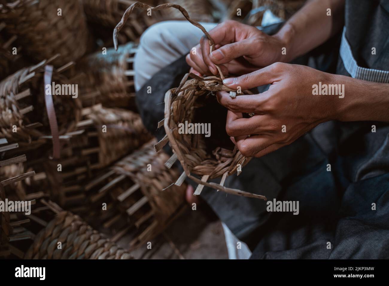 close up of asian craftsman hand weaving crafts Stock Photo - Alamy