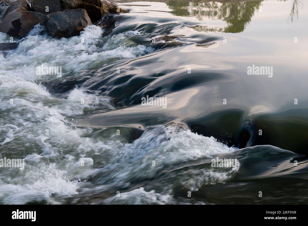 A close up of a little rapid in a river Stock Photo - Alamy