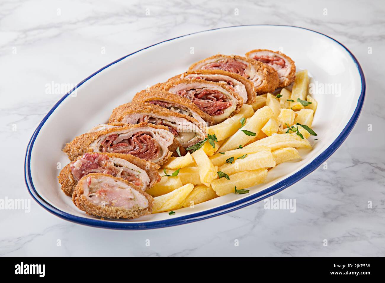 A tasty dish with meat rolls and potato fries Stock Photo - Alamy