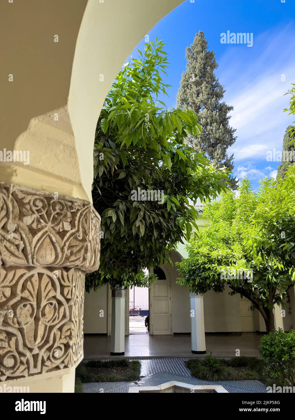 Close-up photo of a hand-carved Moroccan column inside an old riad ...