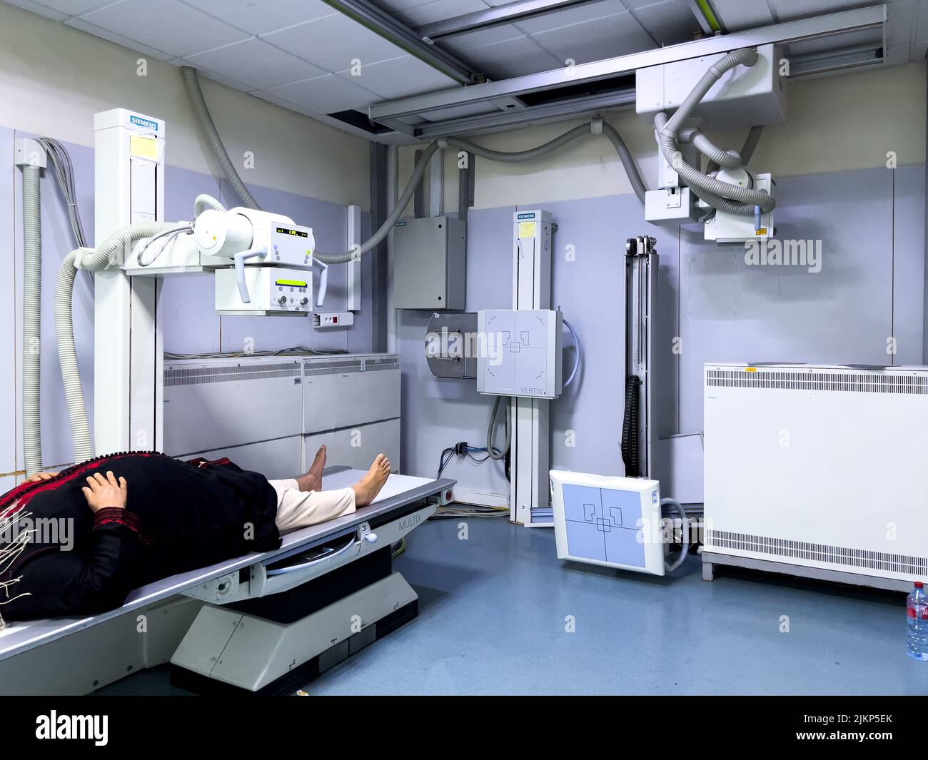 Unrecognizable woman having X-ray scanning session in a public hospital ...