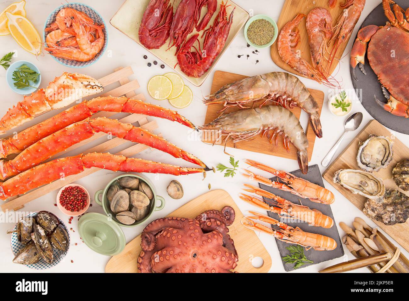 A top view of different freshly cooked seafood on a white table Stock ...
