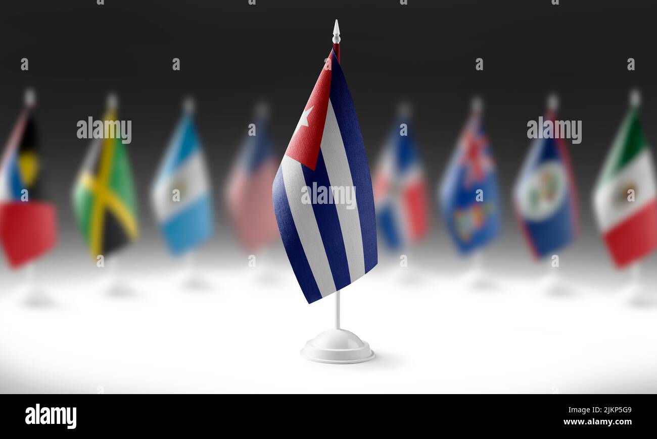 The national flag of the Cuba on the background of flags of other ...
