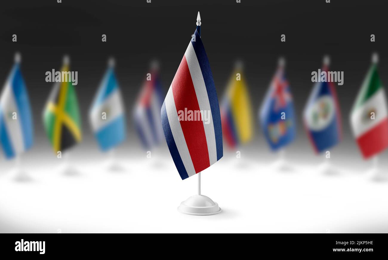 The national flag of the Costa Rica on the background of flags of other ...