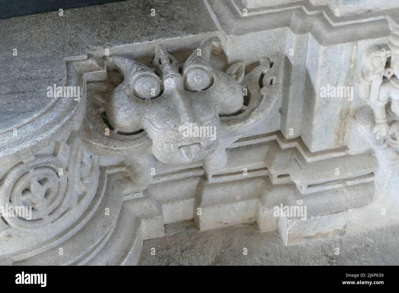 A closeup of an animal head sculpture on the threshold of Ranakpur Jain ...
