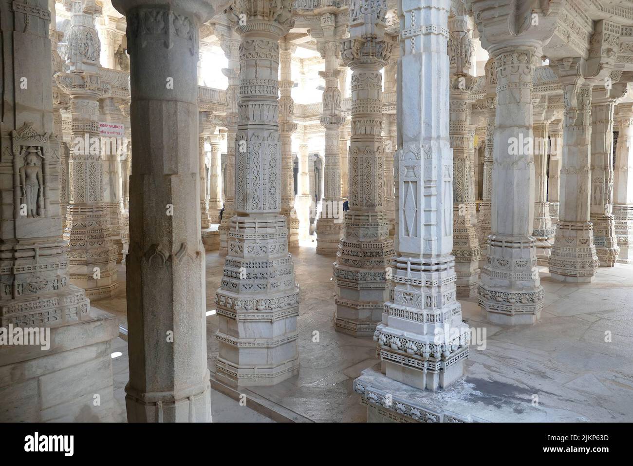 A closeup of rows of intricate sculpted columns in the Ranakpur Jain ...