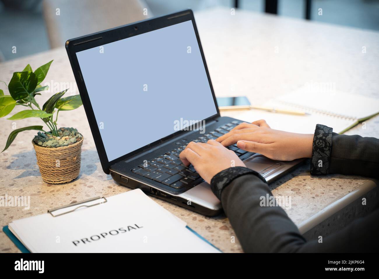 hand typing making a proposal with blank screen laptop Stock Photo - Alamy