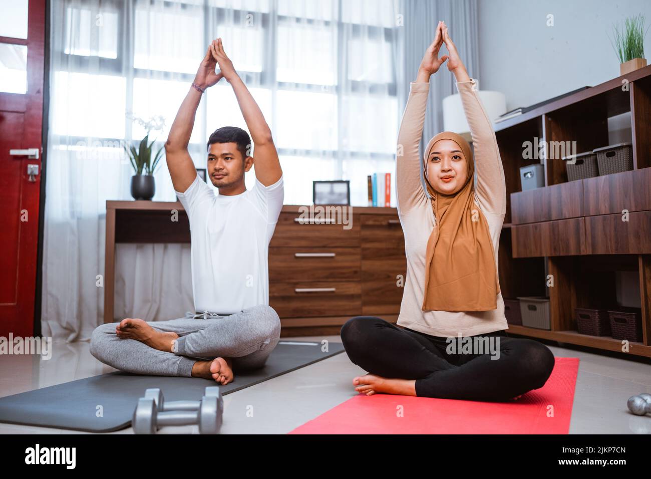 partner workout and stretching together at living room Stock Photo - Alamy
