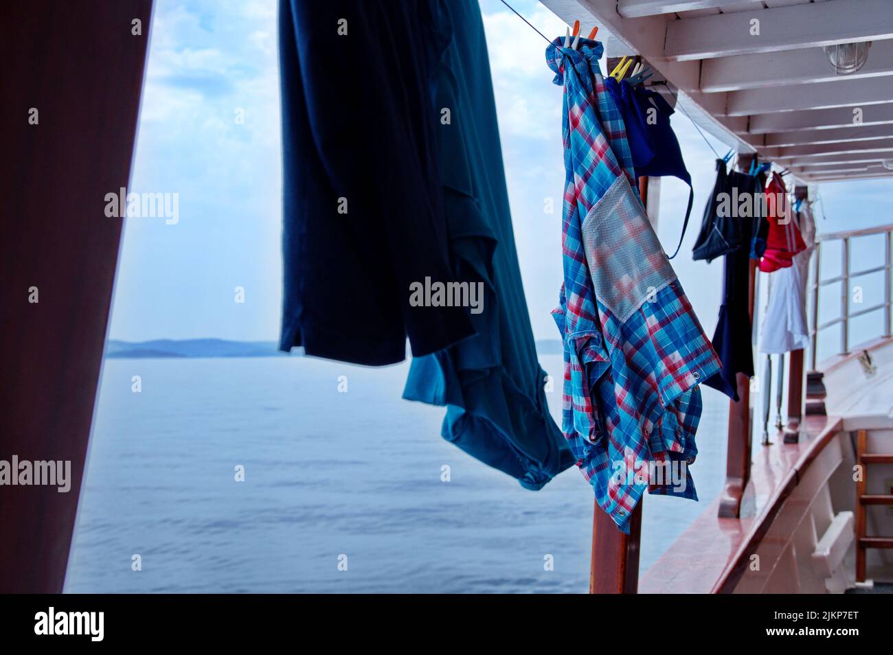 Laundry drying on the fence of sailboat while sailing on Adriatic sea ...