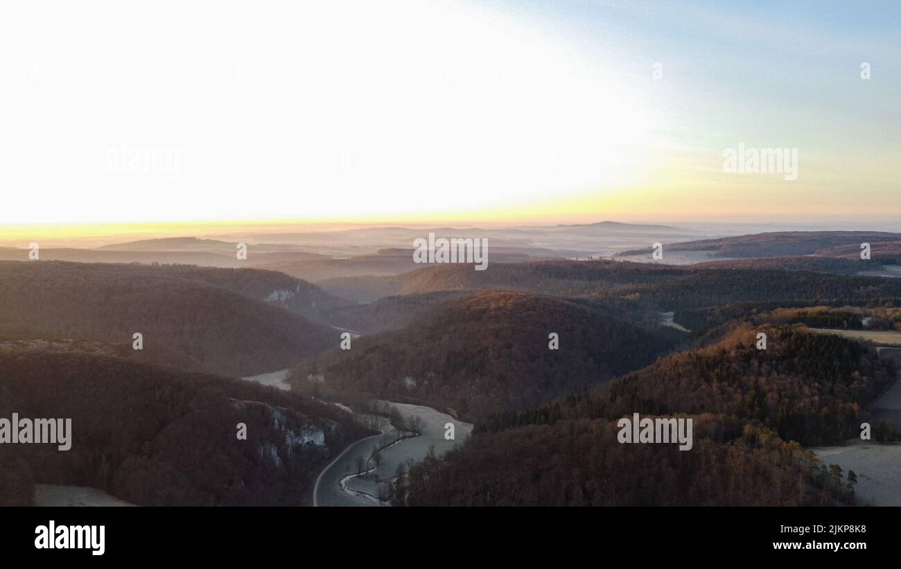 A view of a natural landscape with a river and sunrise Stock Photo - Alamy