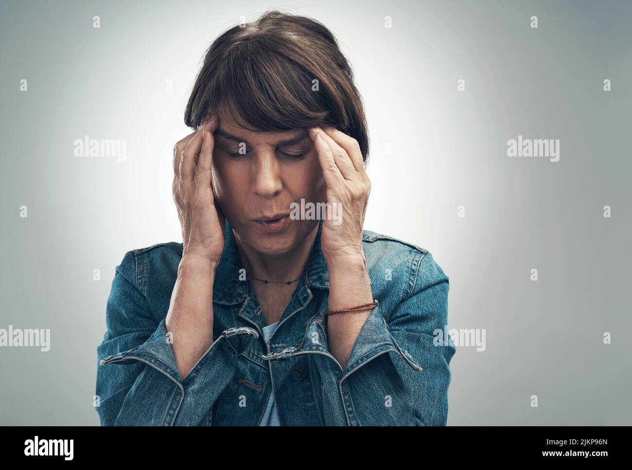 Dear brain, please work. Studio shot of a senior woman experiencing a ...