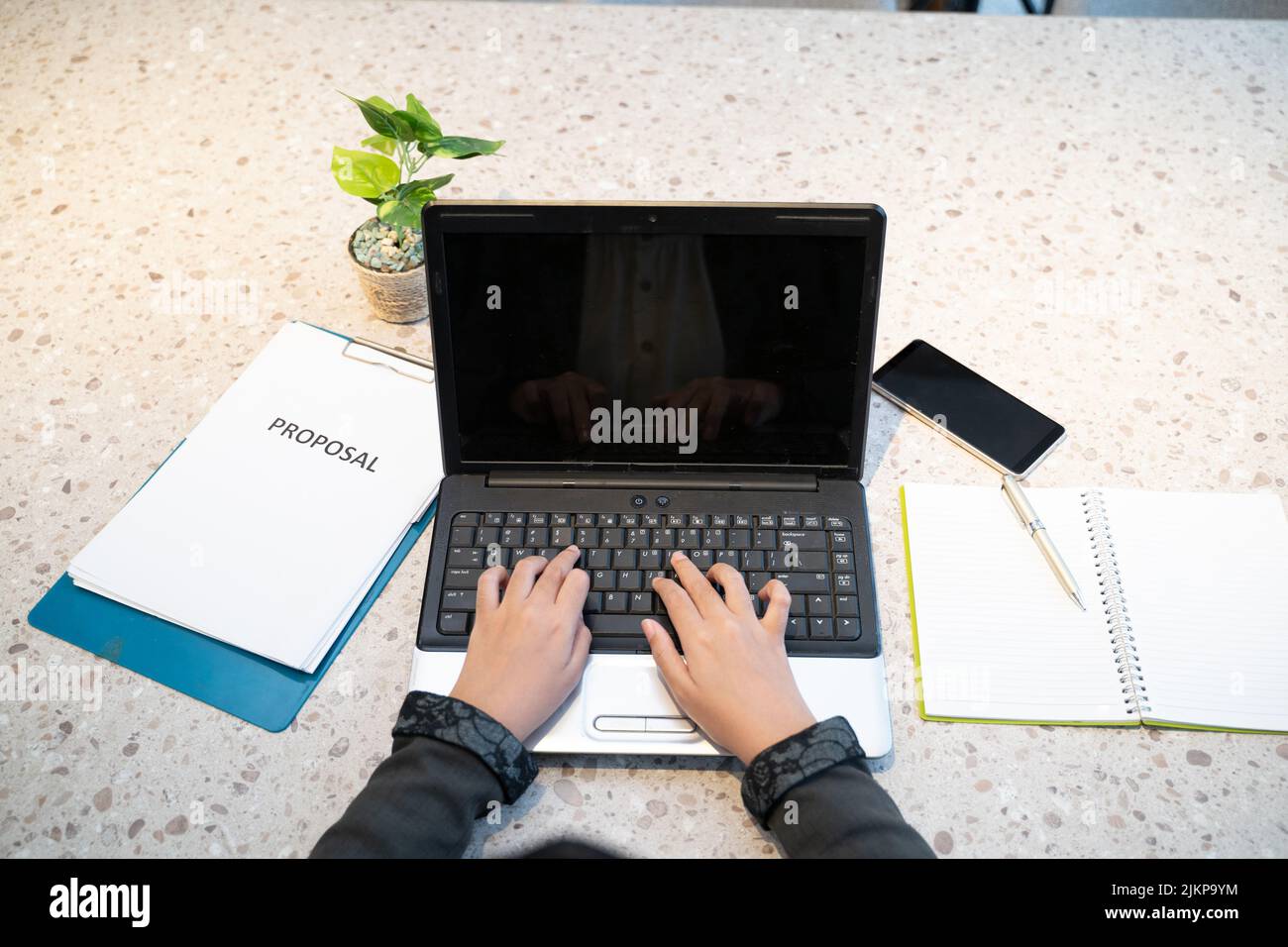 hand typing making a proposal with blank screen laptop Stock Photo - Alamy