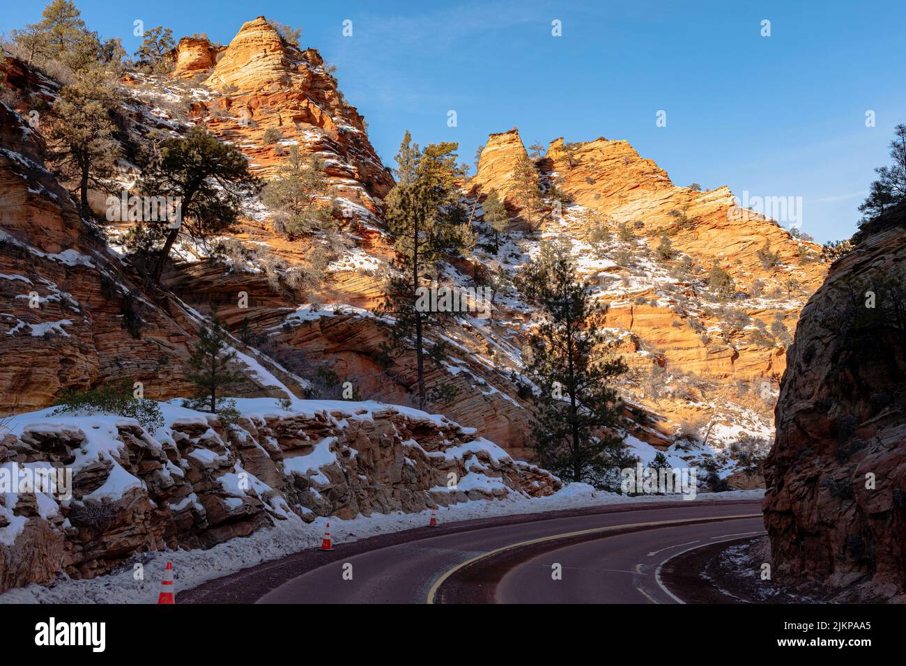 Asphalt road through snow hi-res stock photography and images - Alamy