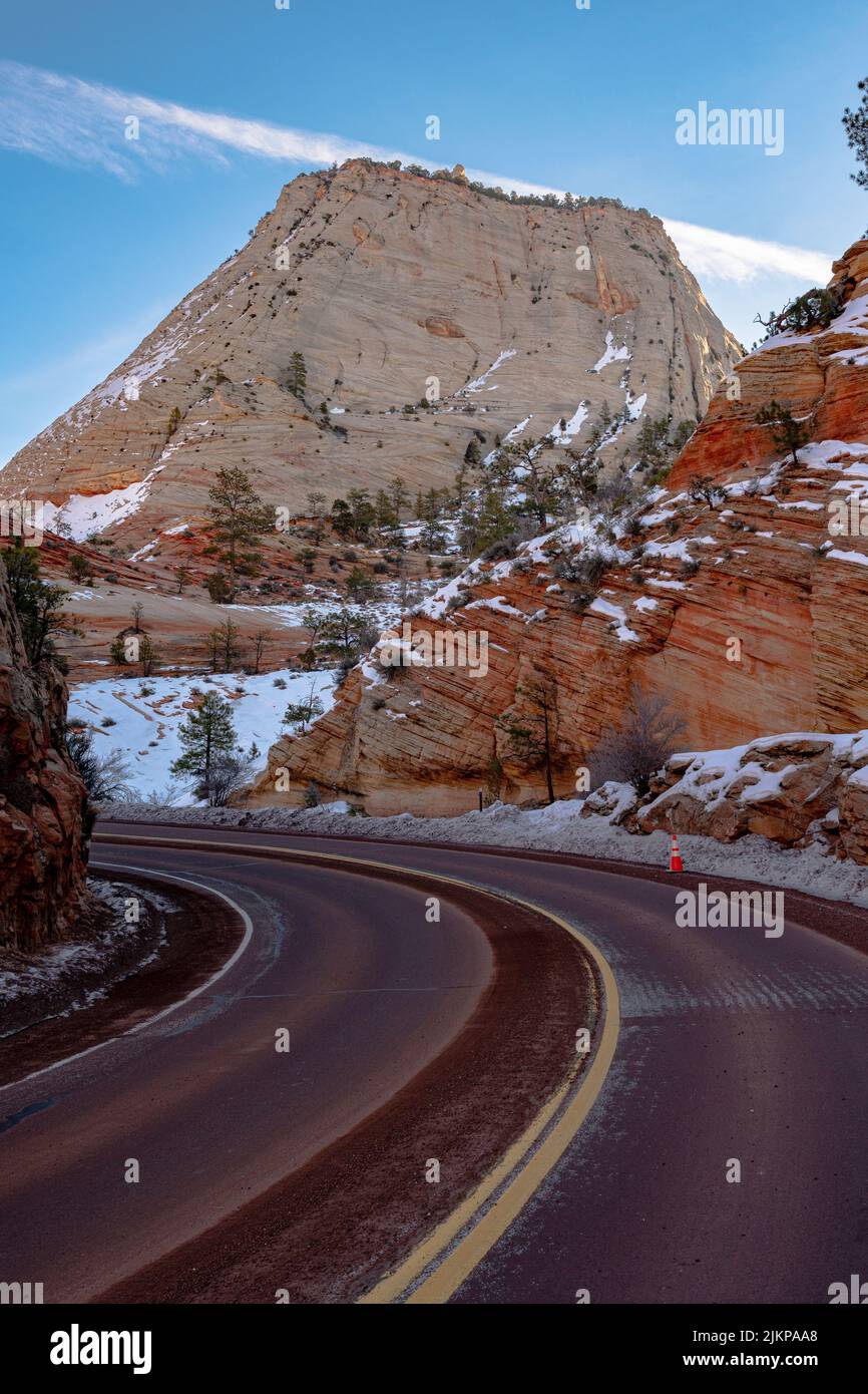 A vertical shot of a curved highway through rocky mountain Stock Photo ...