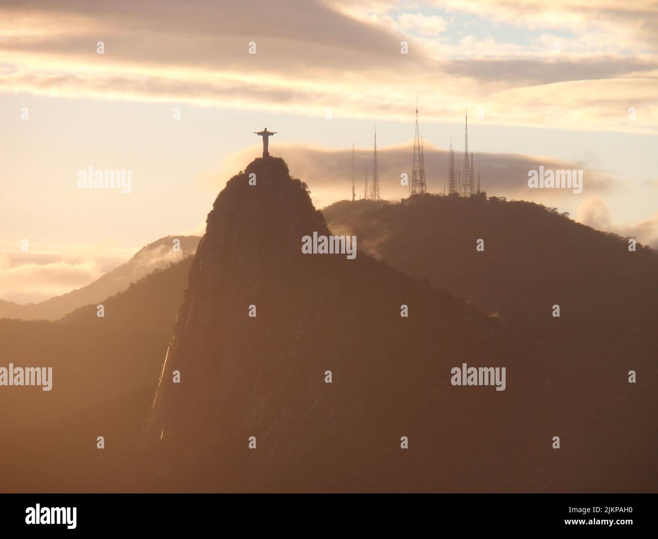 The mesmerizing sunset sky over Christ the Redeemer in Rio de Janeiro ...
