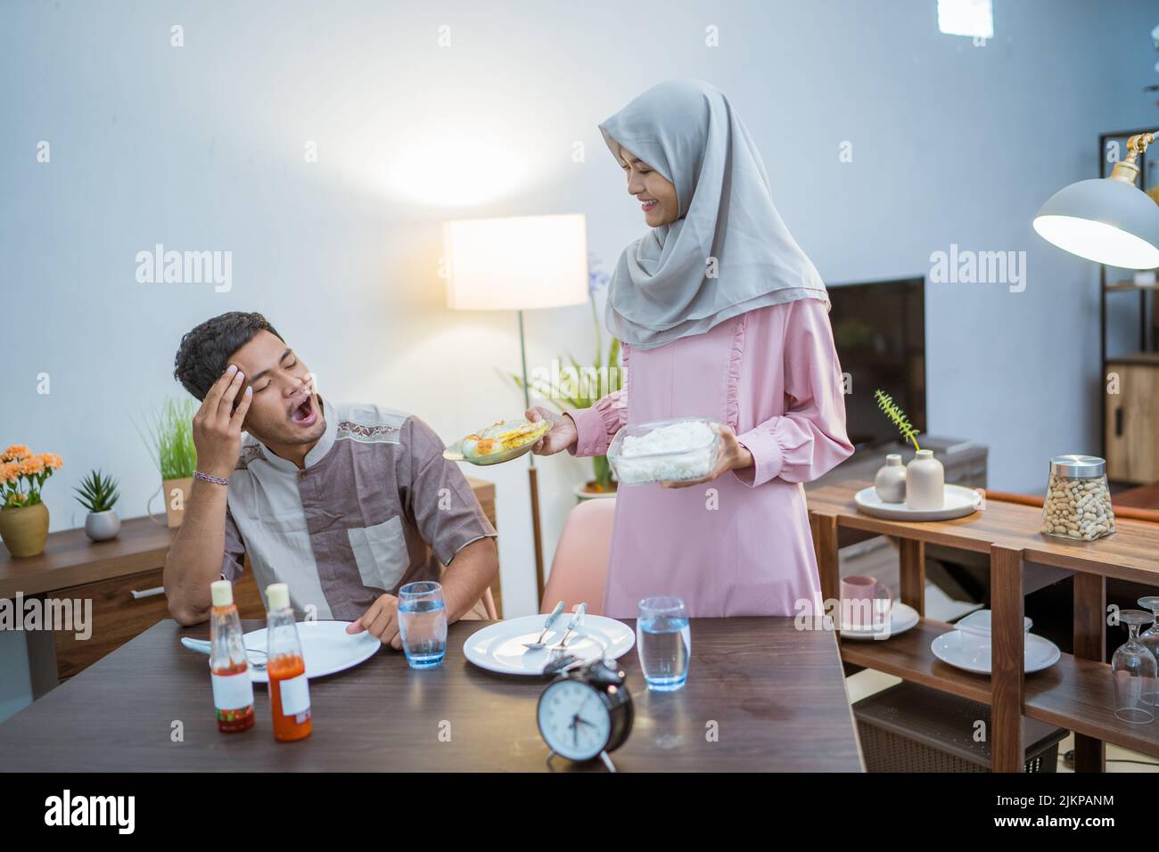 Sleepy asian man having breakfast hi-res stock photography and images ...