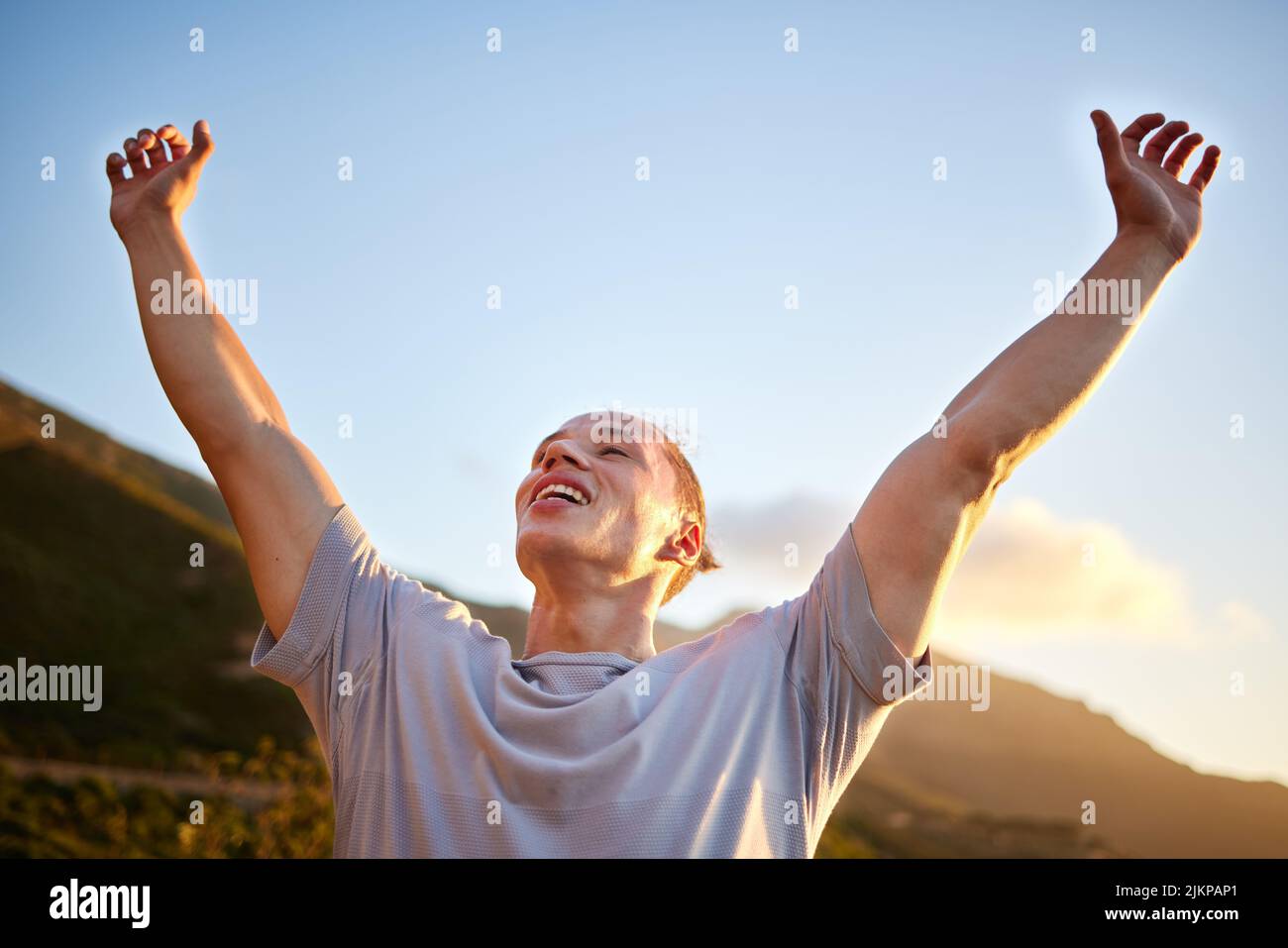 Completing a workout is so rewarding. a young man celebrating the end ...