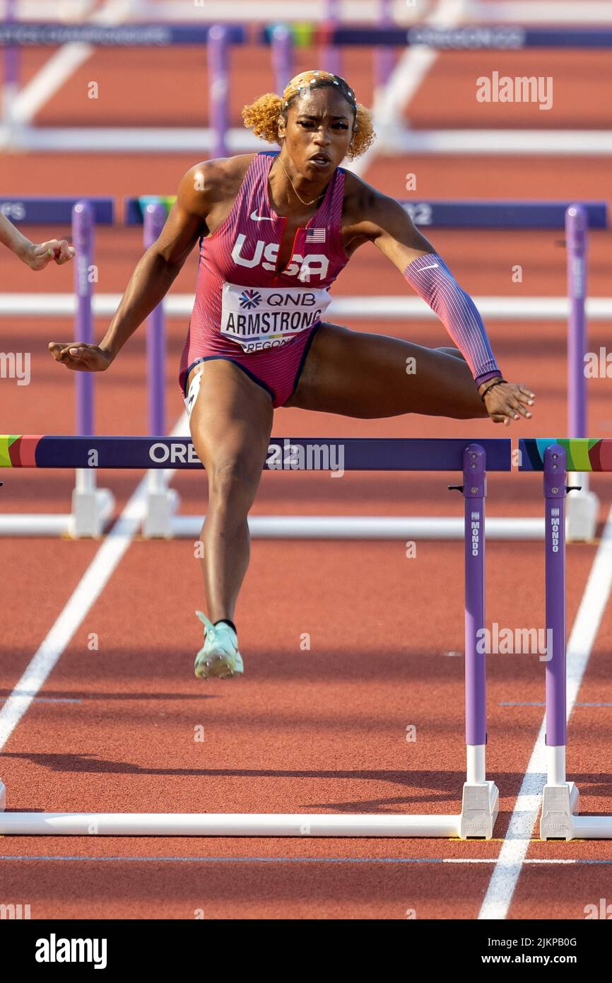 Alia Armstrong (USA) runs a personal best time of 12.43 to advance to ...